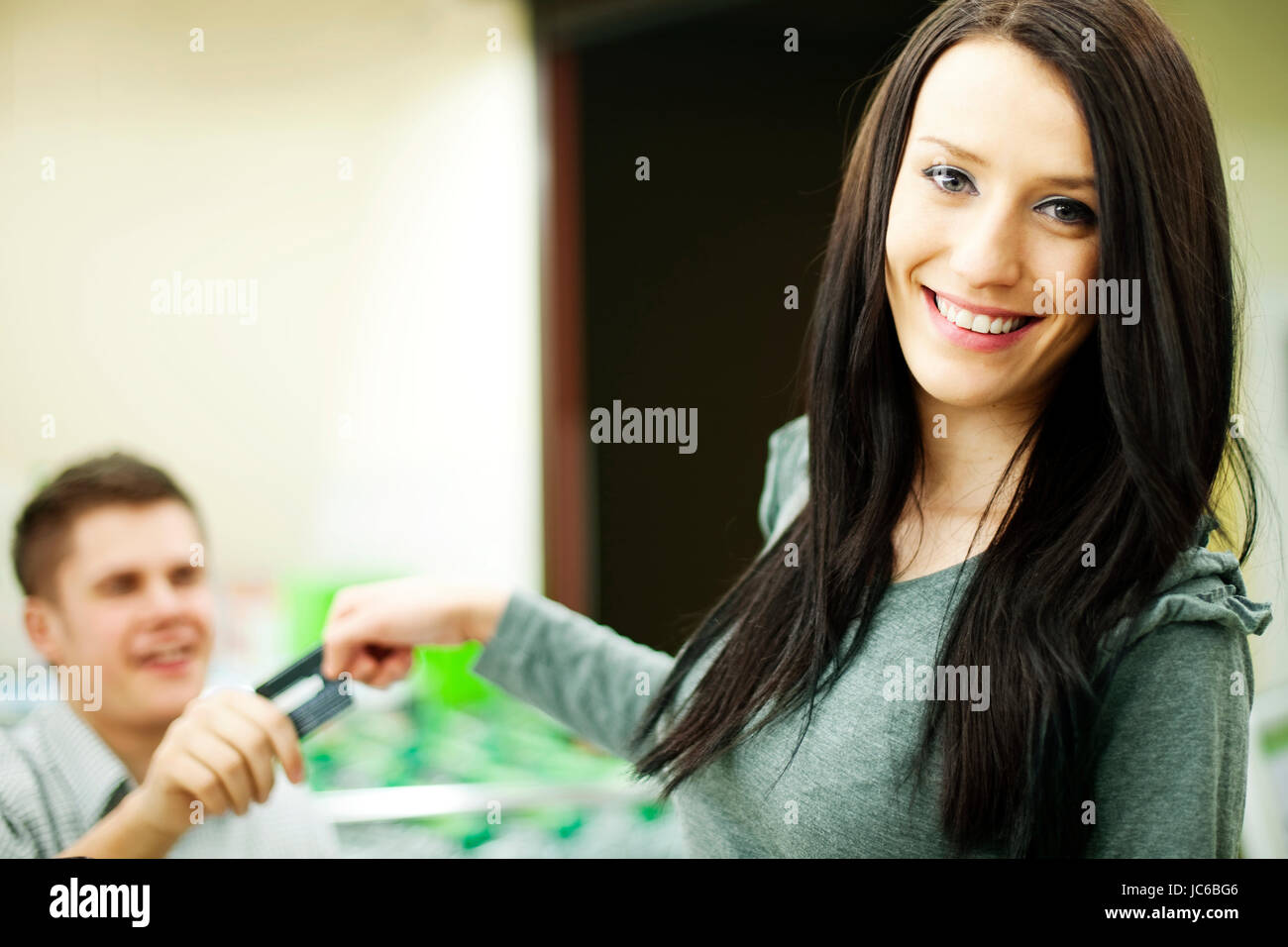 Paying credit card for purchases Stock Photo - Alamy