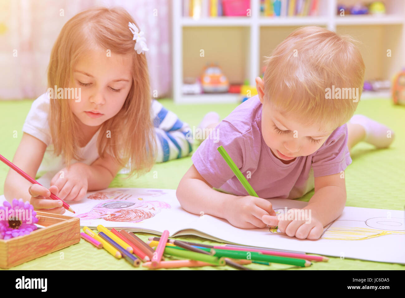 Happy baby boy & girl enjoying homework, preschool developing drawing ...