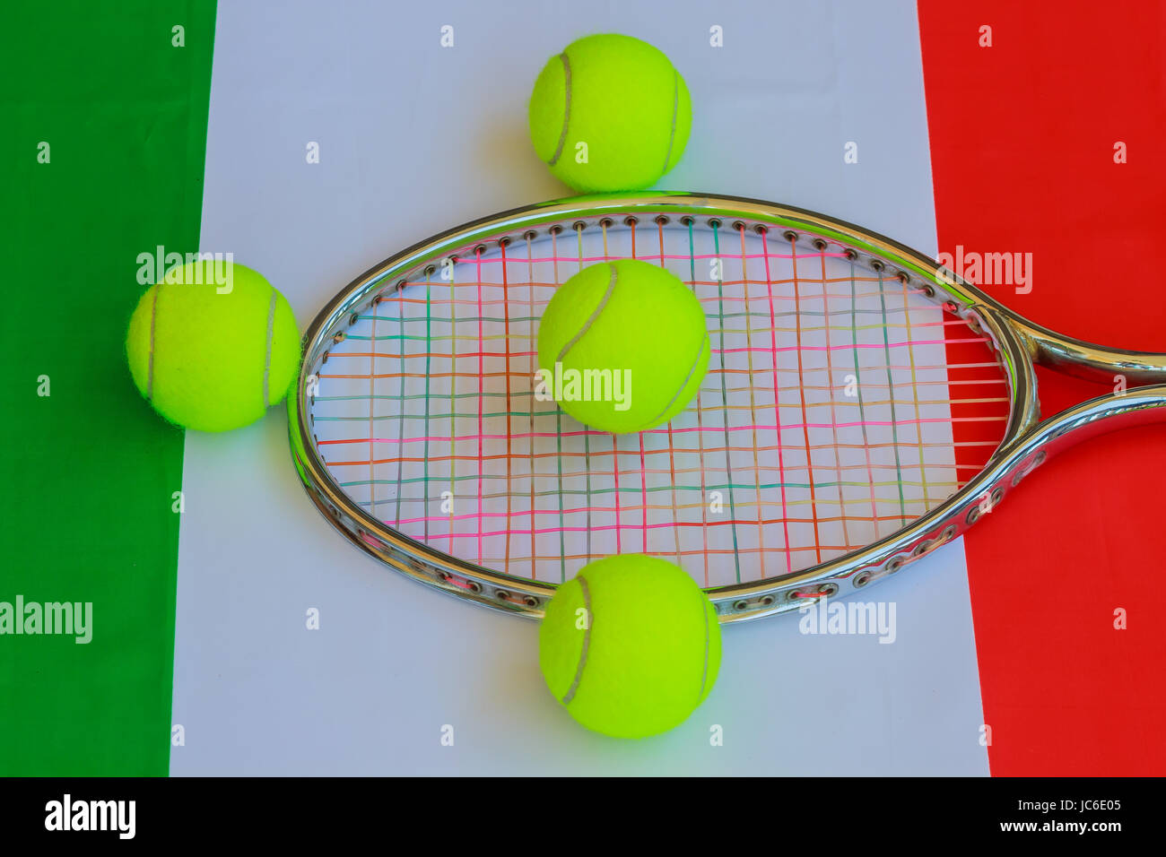 tennis racket in metal with colored ropes and yellow tennis balls with ...