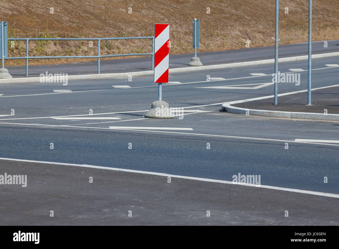 Red and white striped warning road signs Stock Photo - Alamy