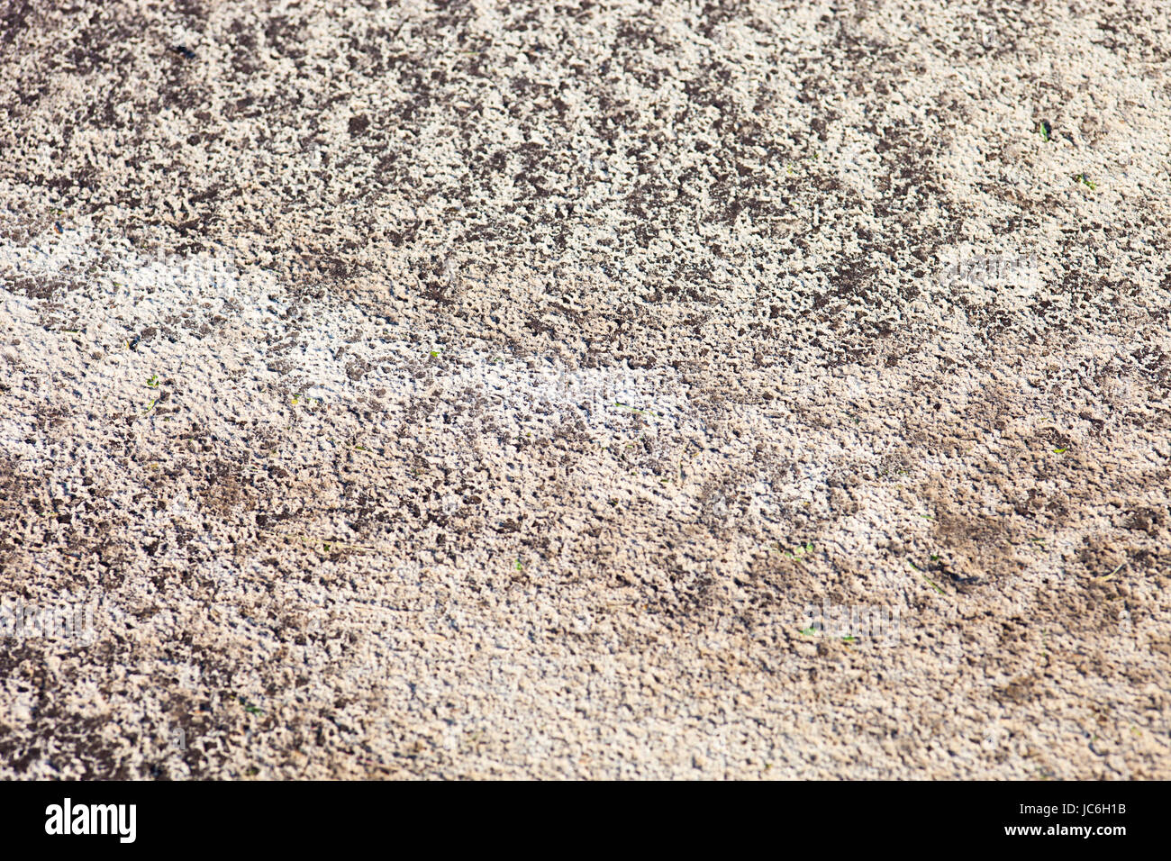 Sand surface after the rain with the visible traces of the raindrops ...