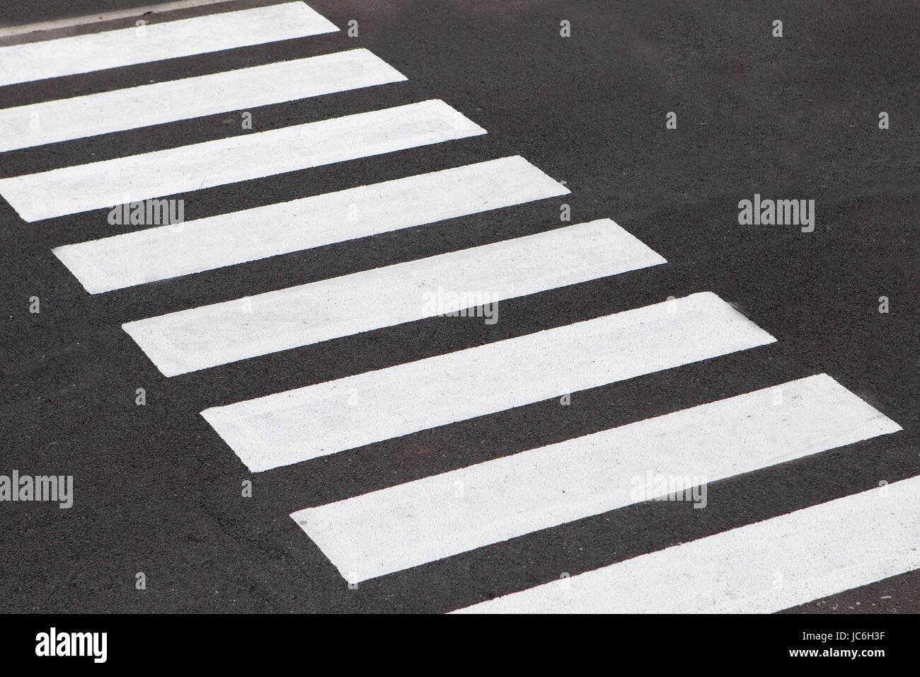 White stripes of a zebra crossing on the road Stock Photo - Alamy
