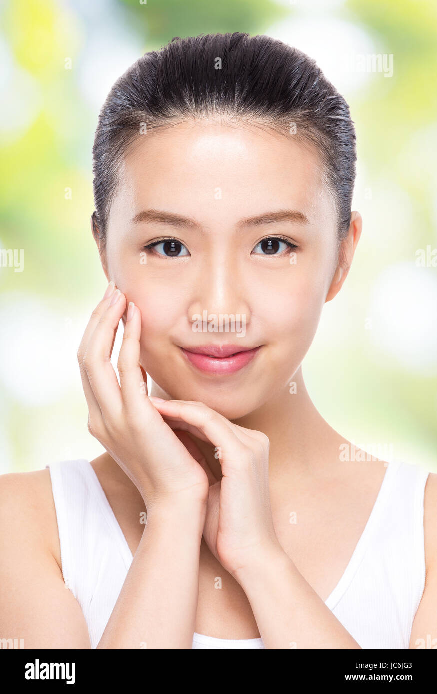 Asian woman clean face skin Stock Photo - Alamy
