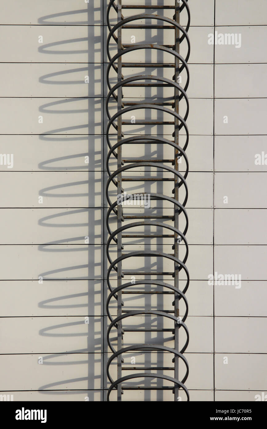 Fire escape and shadow on the wall of an office building Stock Photo ...