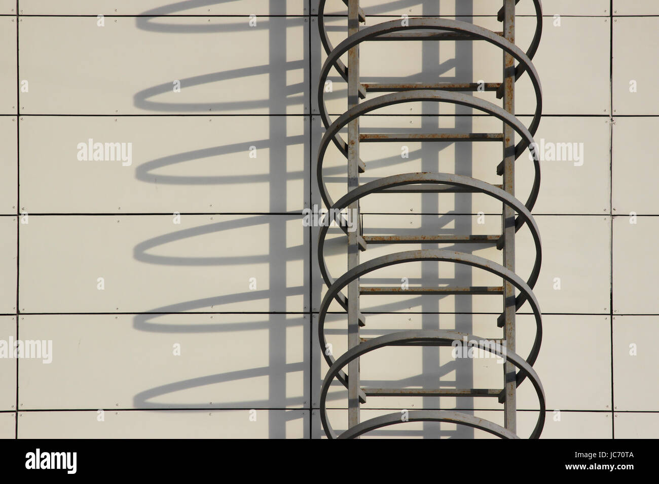 Fire escape and shadow on the wall of an office building Stock Photo ...