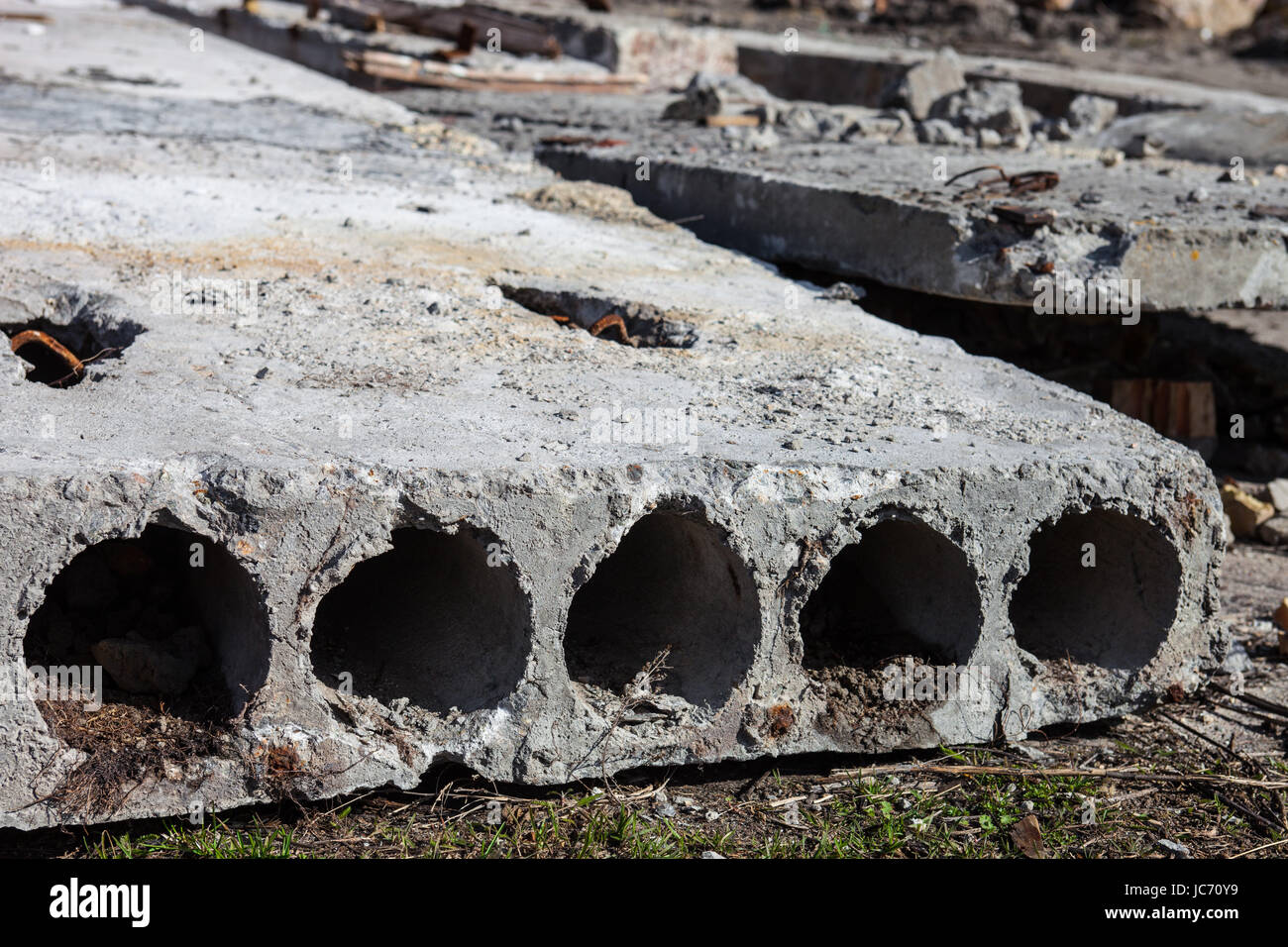 Old and damaged concrete blocks on the ground Stock Photo - Alamy