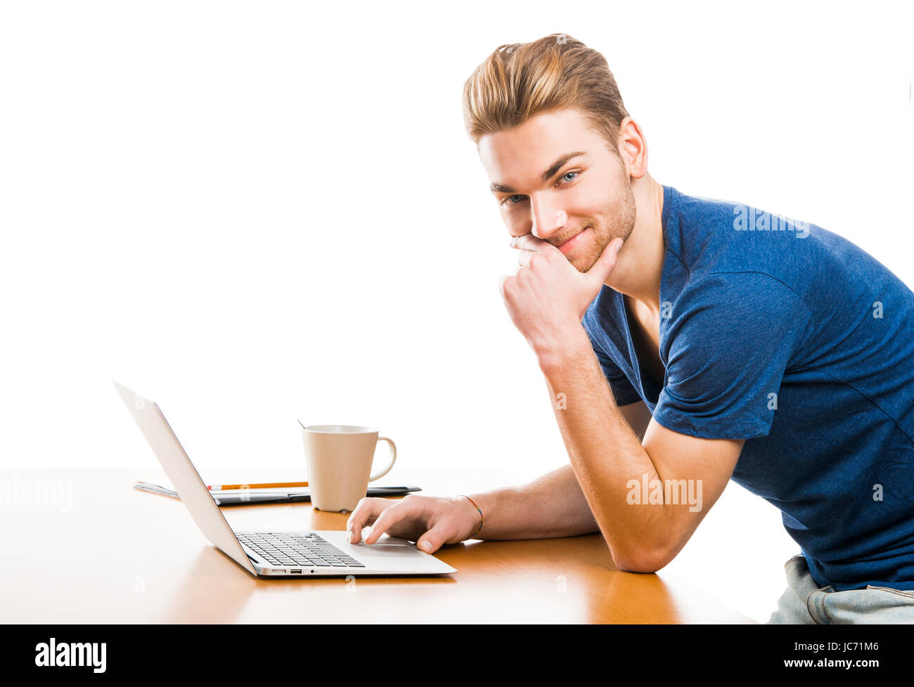 Good looking young man in the office working, isolated over white ...