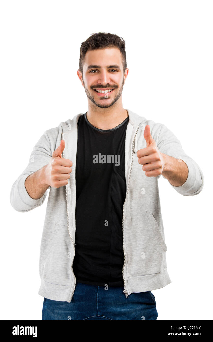 Beautiful and happy man smiling with thumbs up Stock Photo - Alamy