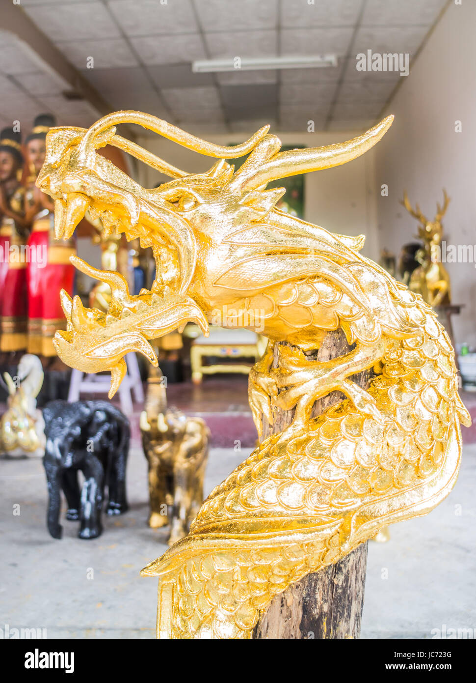 Wood carving of golden color dragon, stock photo Stock Photo - Alamy