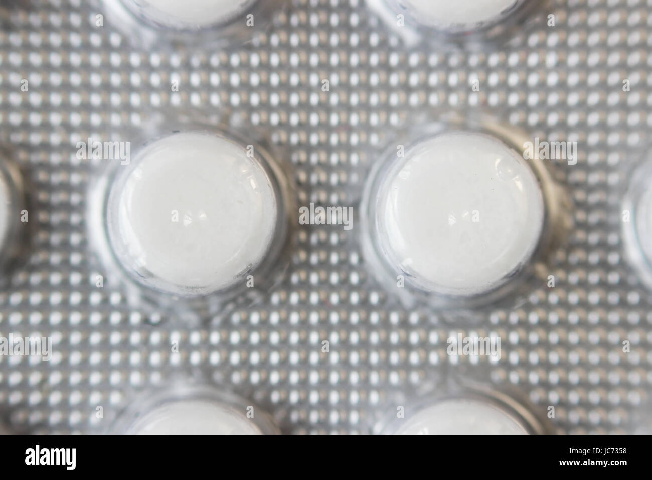 Macro photo many white small tablets in blister push-trough pack Stock ...