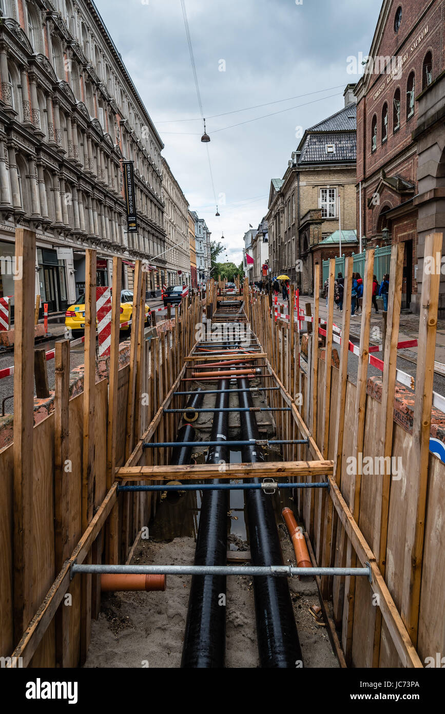 Trench shoring for pipe passage in historical city street Stock Photo ...