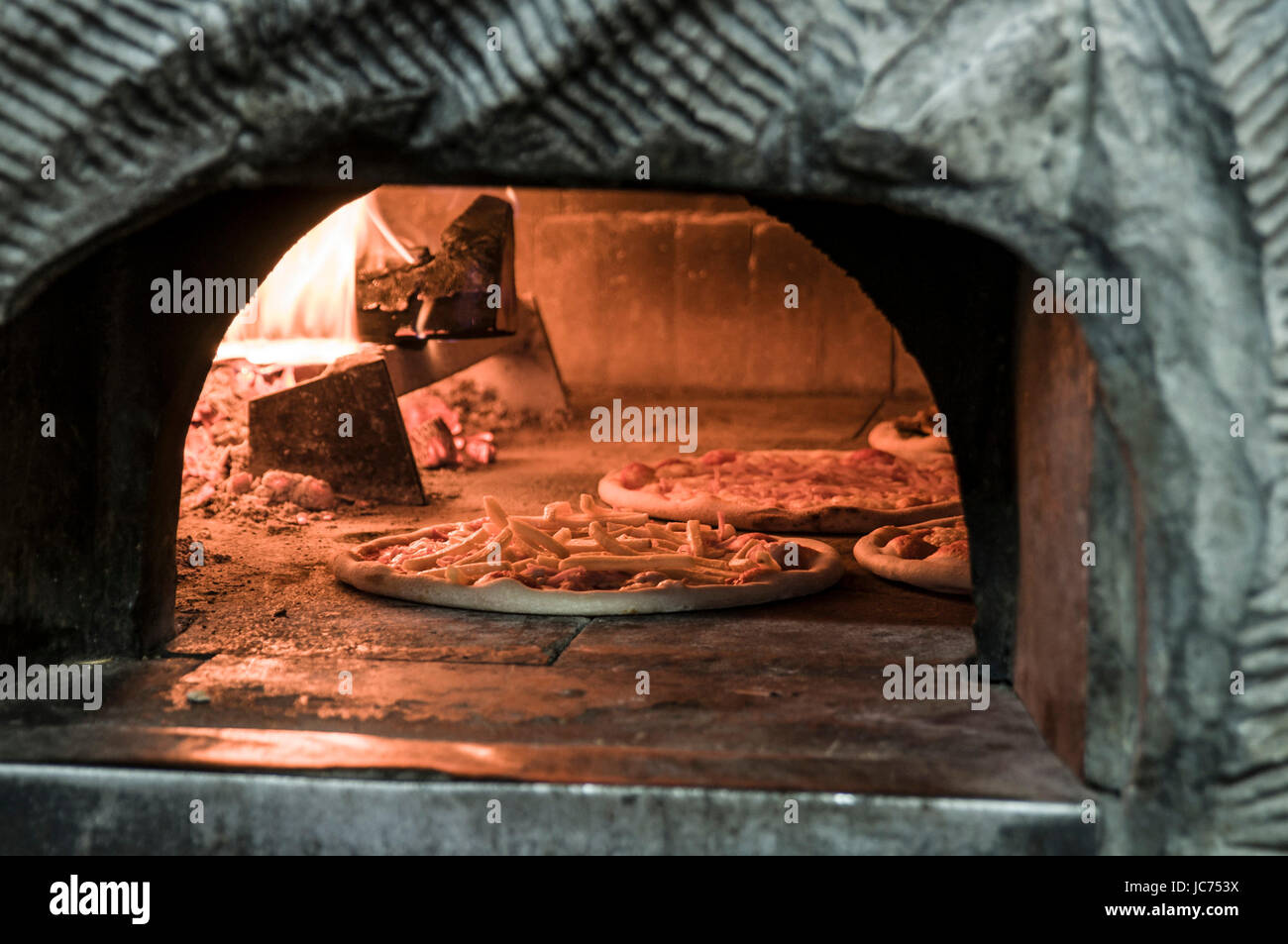 Pizzas inside a traditional Italian oven Stock Photo - Alamy