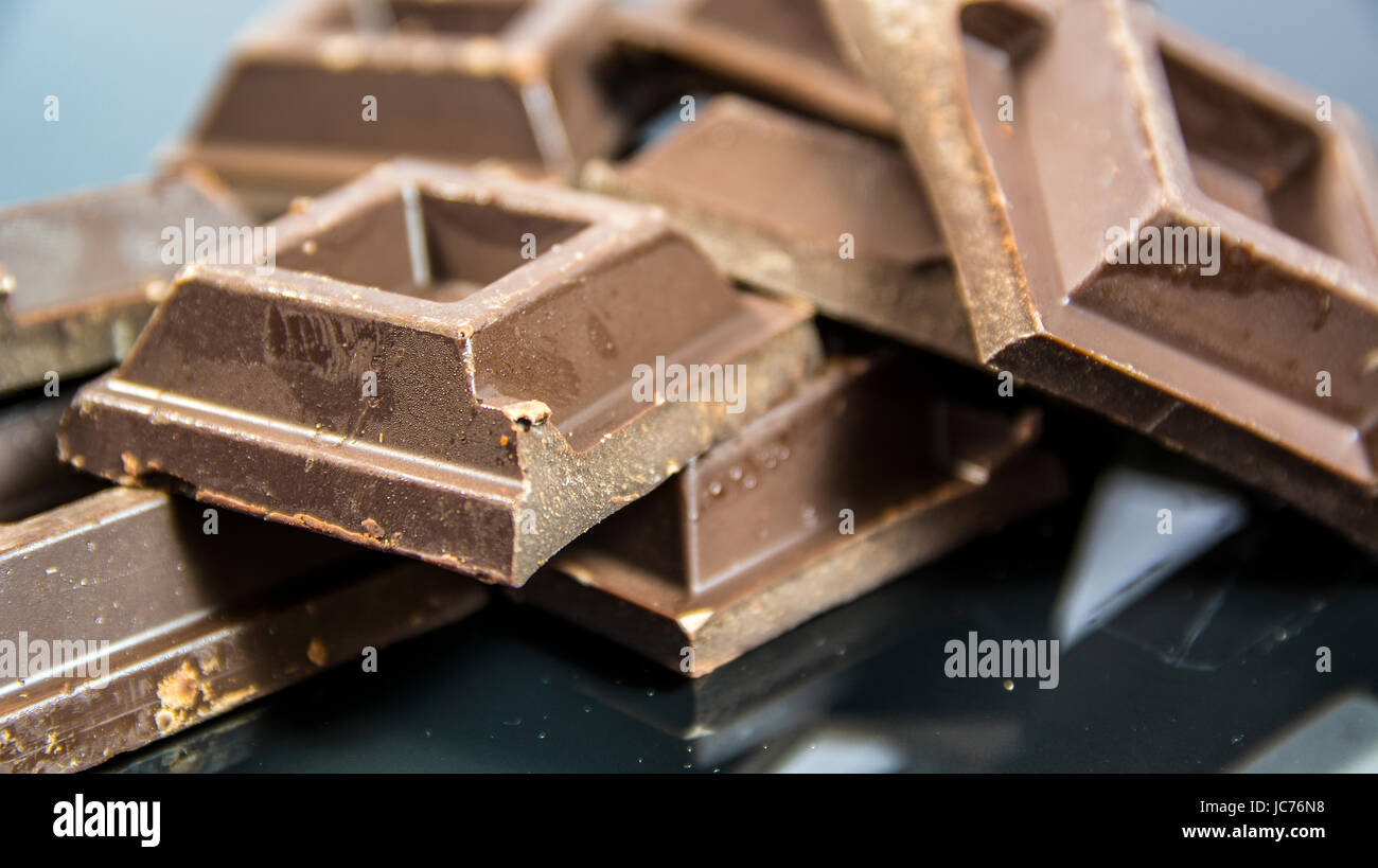 Pieces of dark chocolate bar on neutral background in studio shot Stock ...