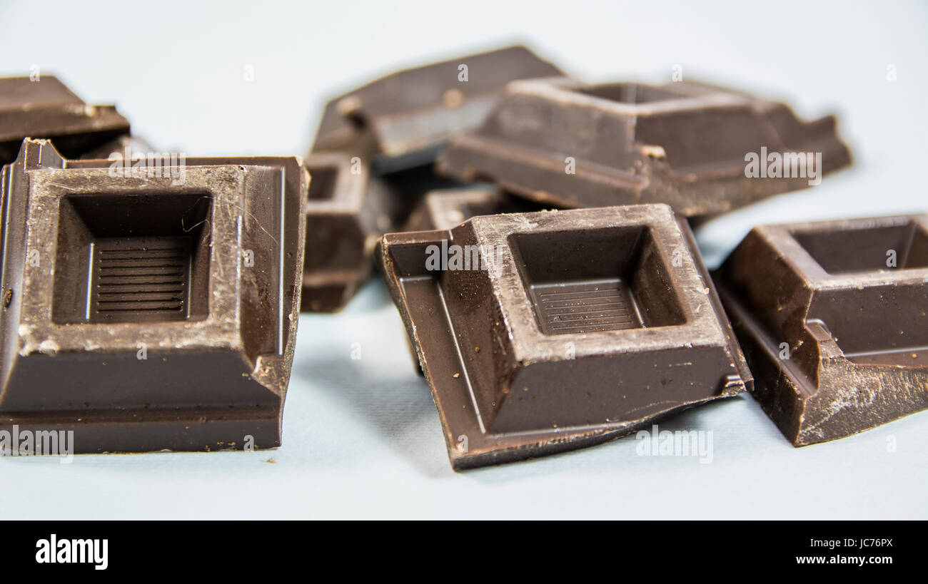 Pieces of dark chocolate bar on neutral background in studio shot Stock ...