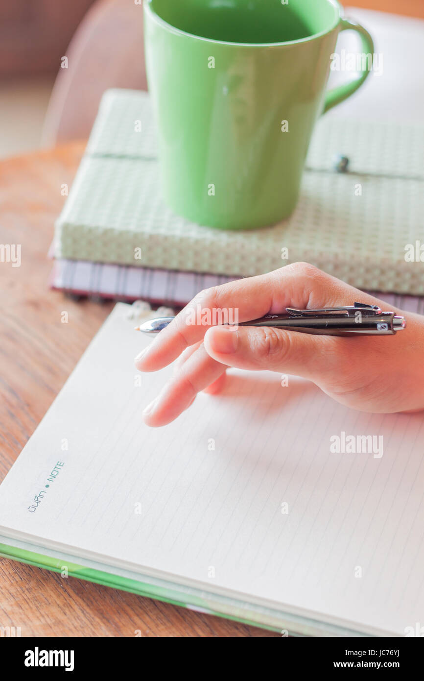 Thinking something to write on notebook, stock photo Stock Photo - Alamy