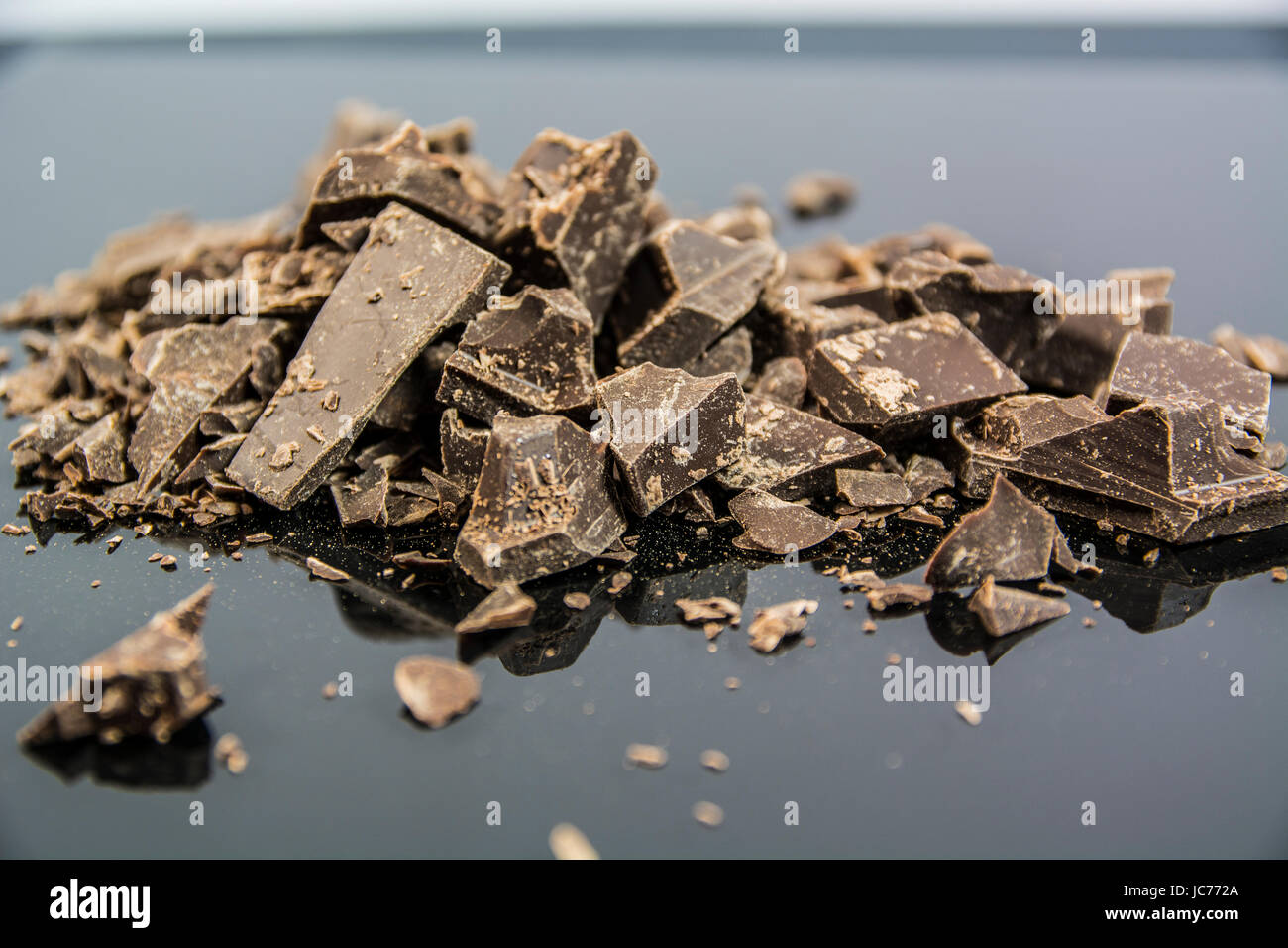 Pieces of dark chocolate bar on neutral background in studio shot Stock ...