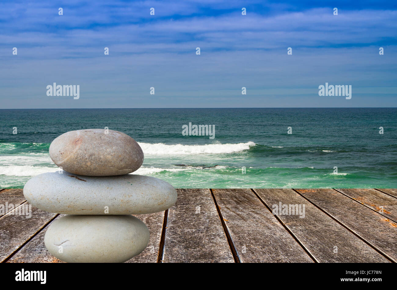 Stacked stones at the beach Stock Photo - Alamy
