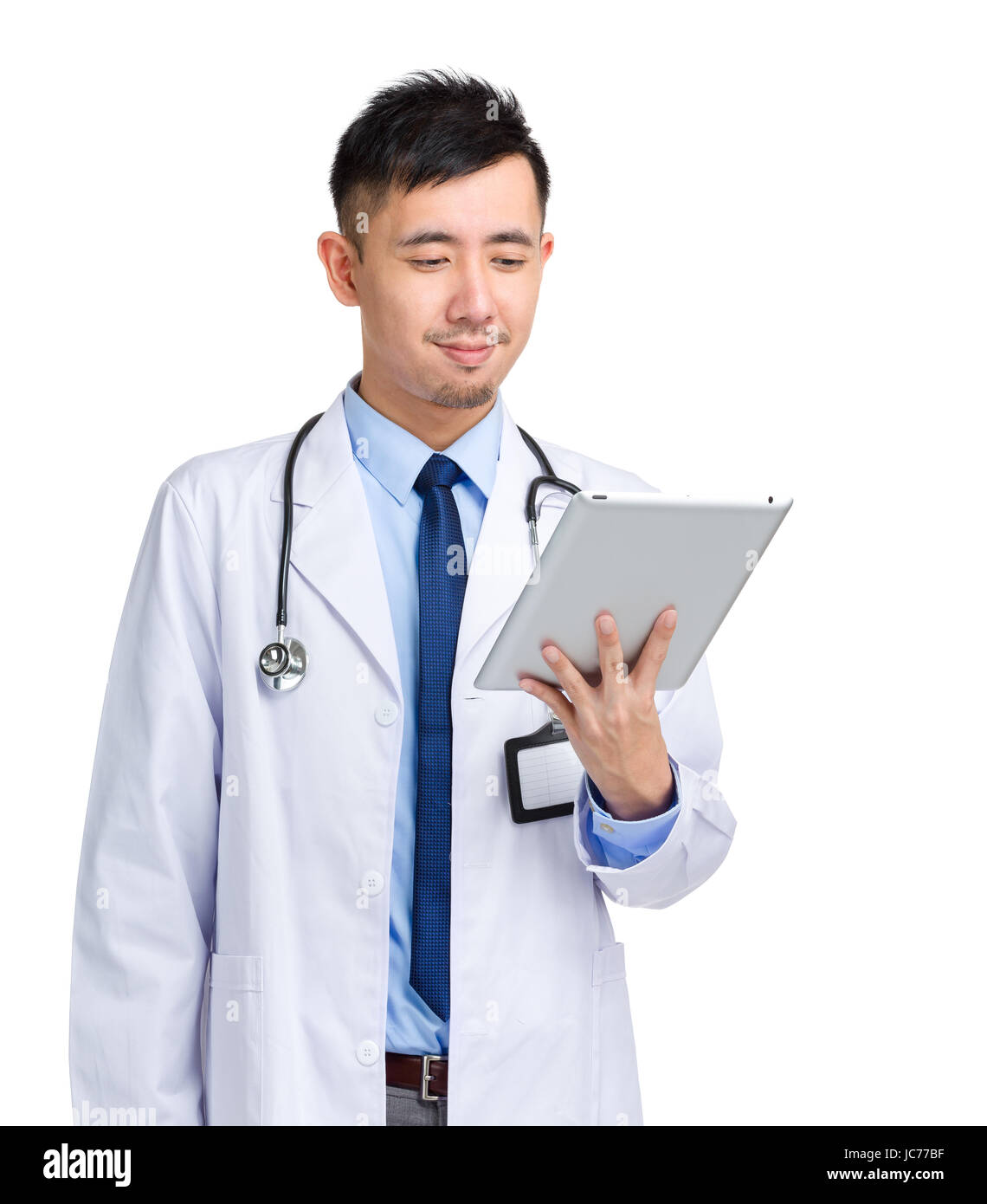 Doctor look at digital tablet Stock Photo - Alamy