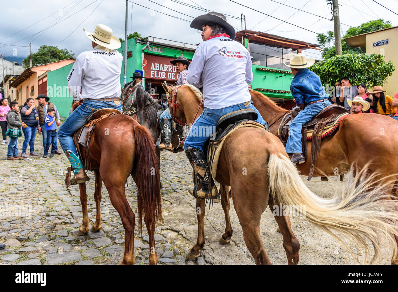 San Juan del Obispo, Guatemala - June 12, 2016: Cowboys ride horses in ...