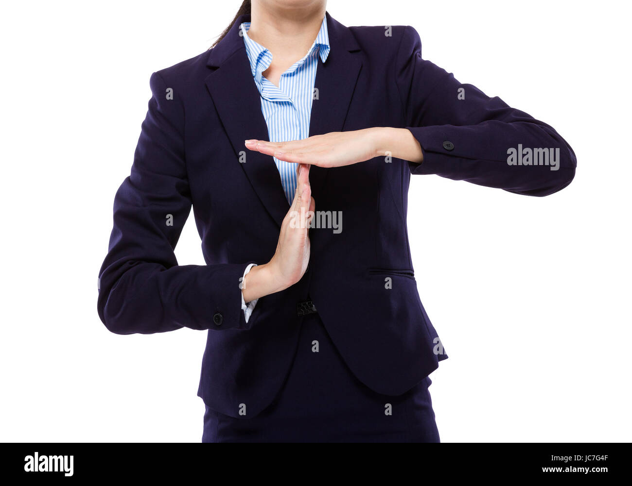 Businesswoman with pause hand gesture Stock Photo - Alamy