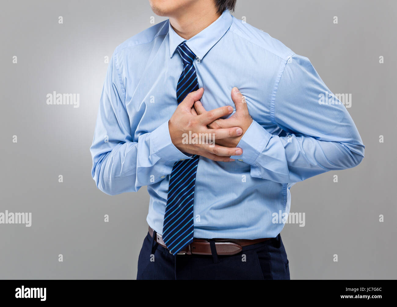 Businessman with heart attack Stock Photo - Alamy