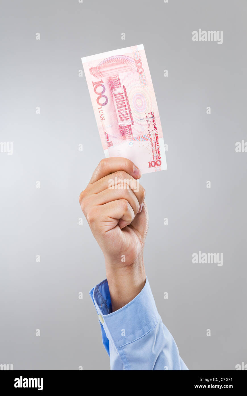 Businessman hand hold with hundred RMB Stock Photo - Alamy