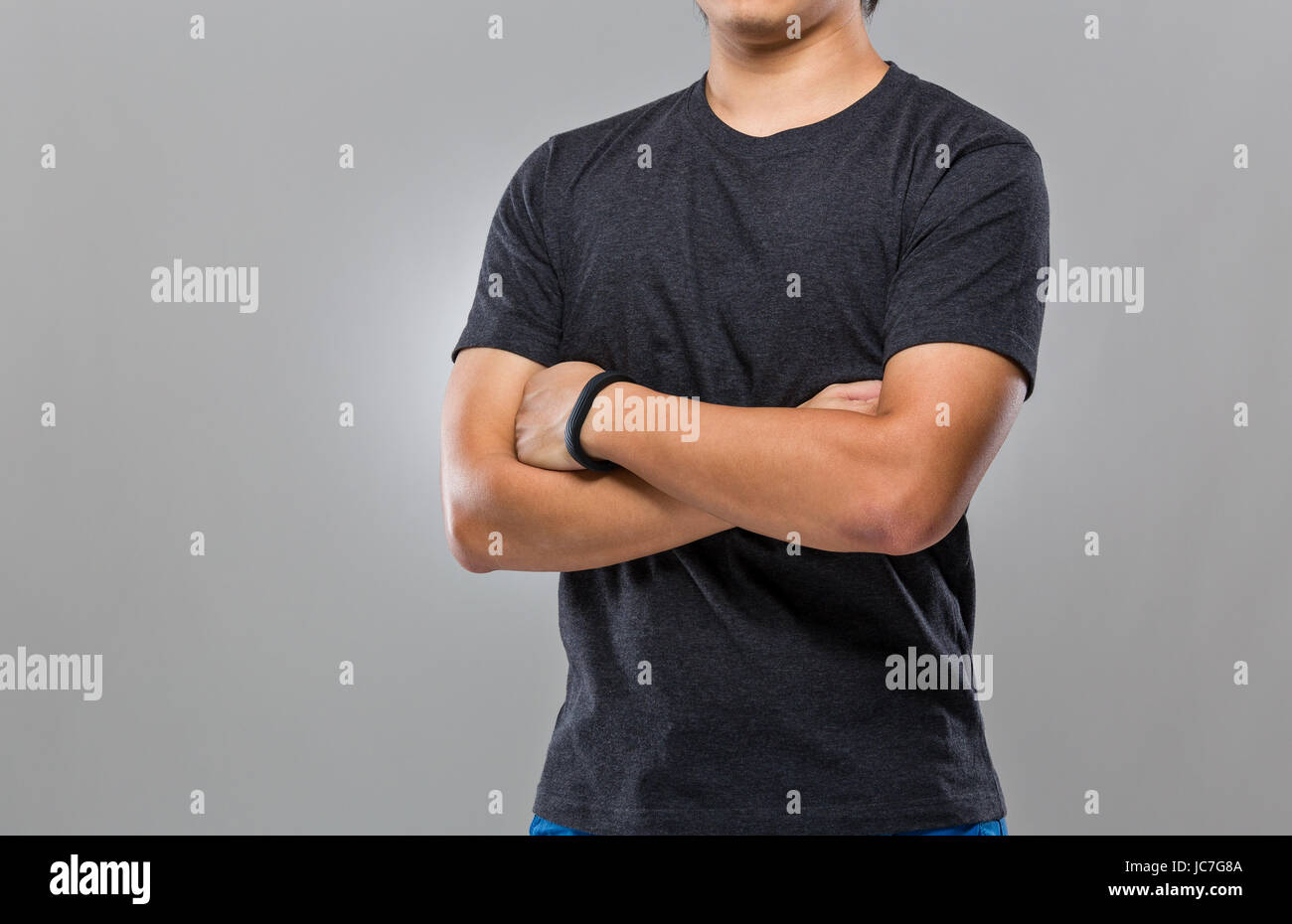 Sportman crossed arm Stock Photo - Alamy