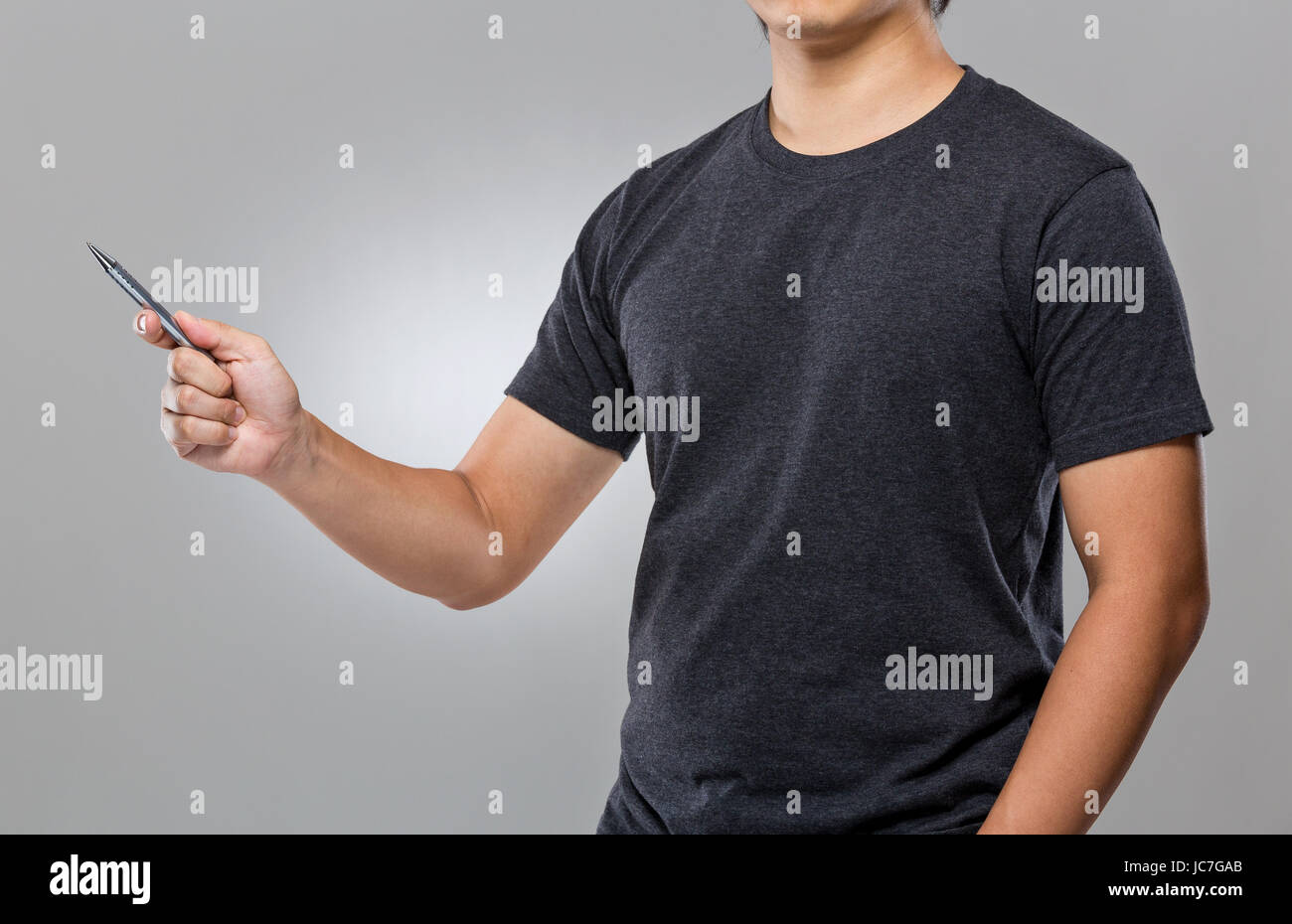 Man hold with pen and point up Stock Photo - Alamy