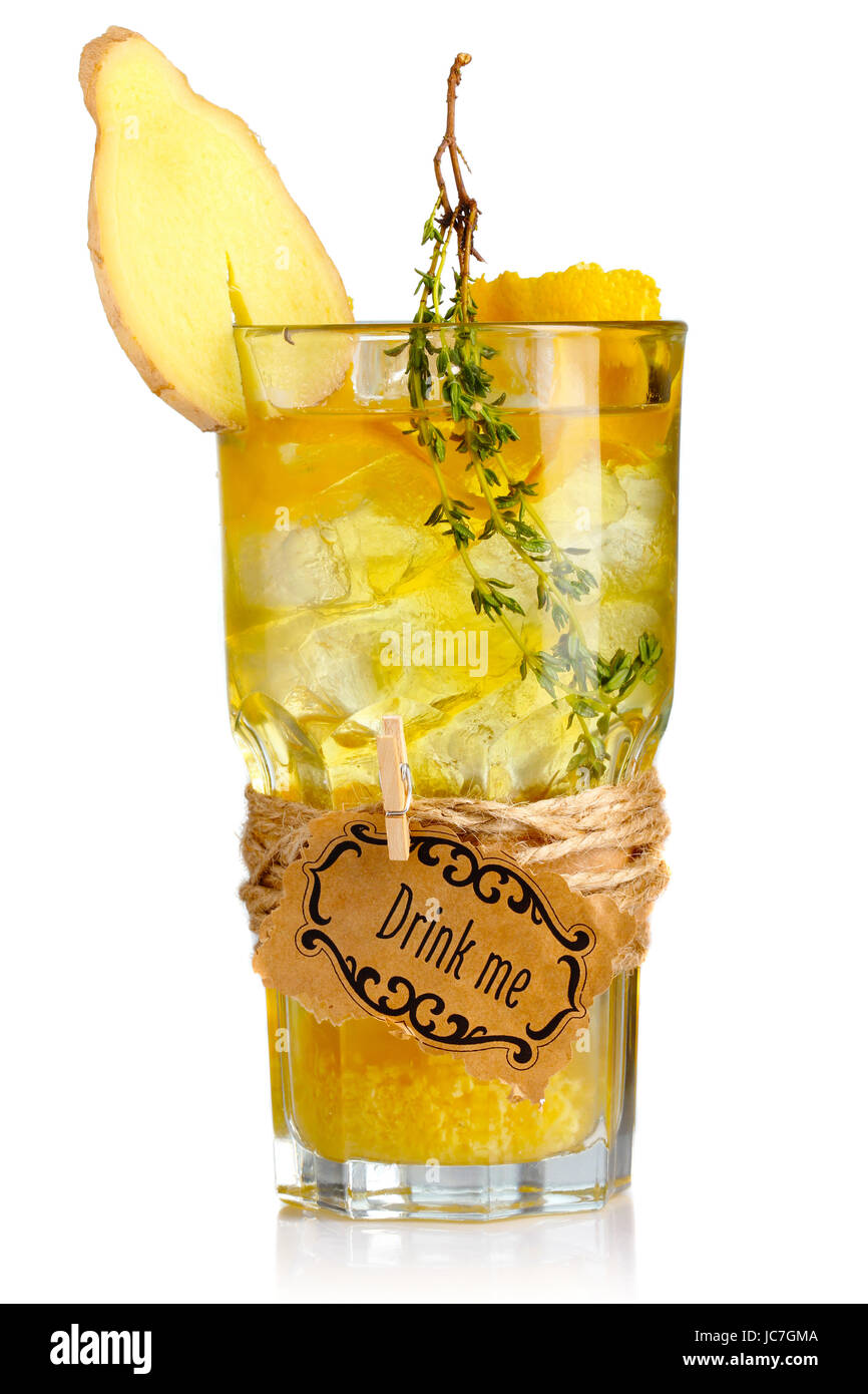 Yellow alcohol cocktail in glass with ginger slice and spices isolated ...