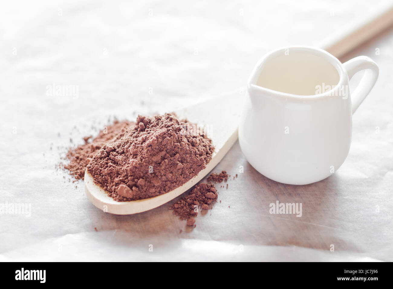 Powdered cocoa ingredient and fresh milk, stock photo Stock Photo - Alamy