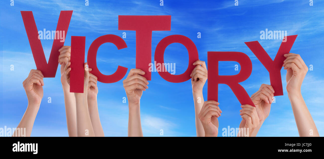 Many Hands Holding the Word Victory in the Sky Stock Photo - Alamy
