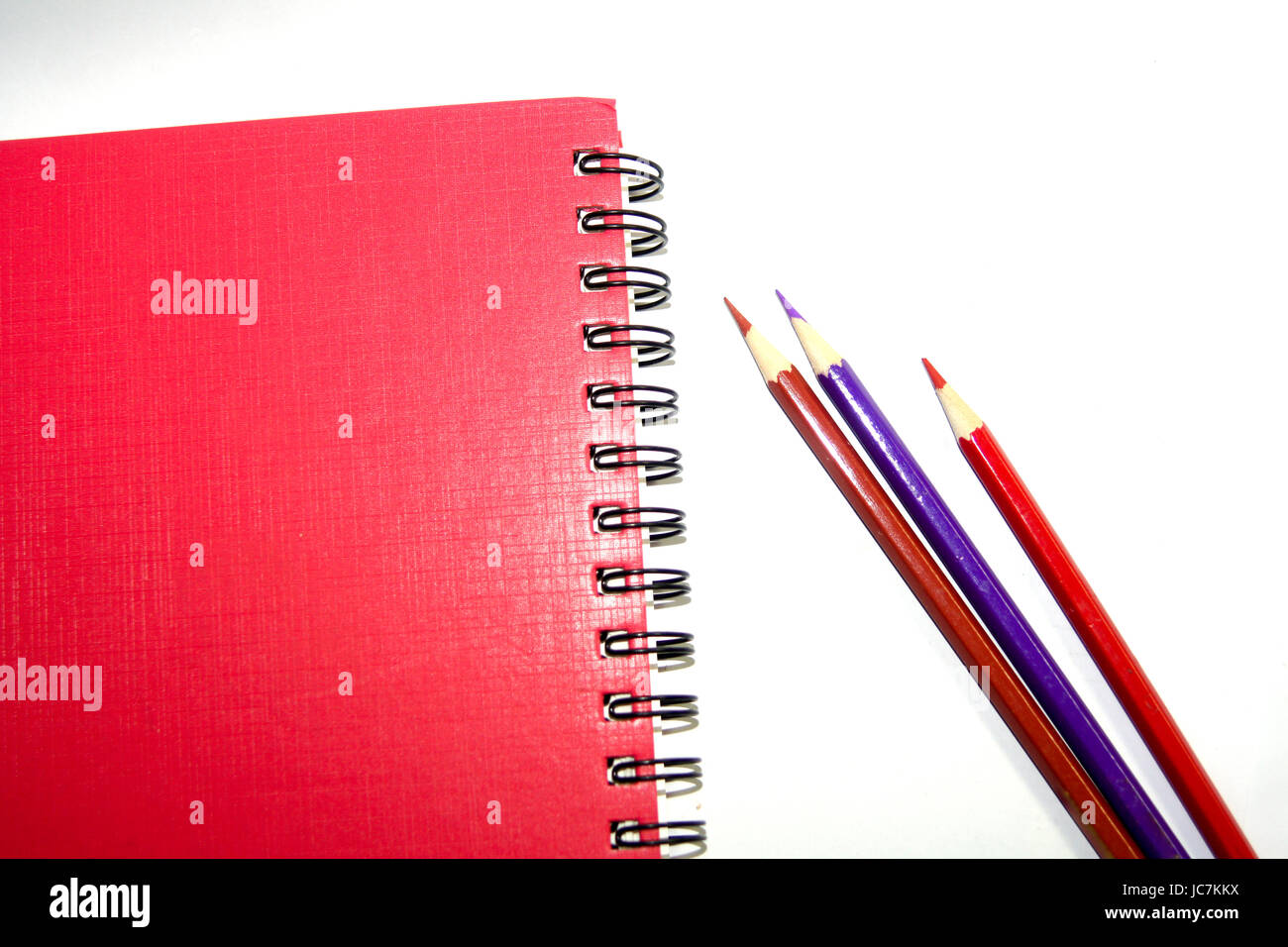 Pencil book on white background Stock Photo - Alamy
