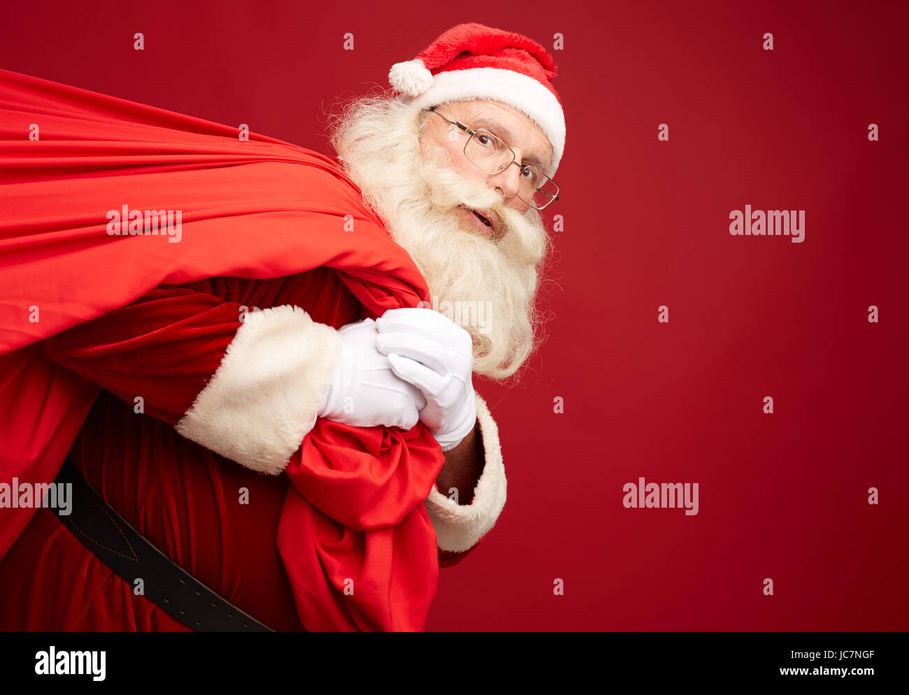 Portrait of Santa Claus with huge red sack in isolation Stock Photo - Alamy