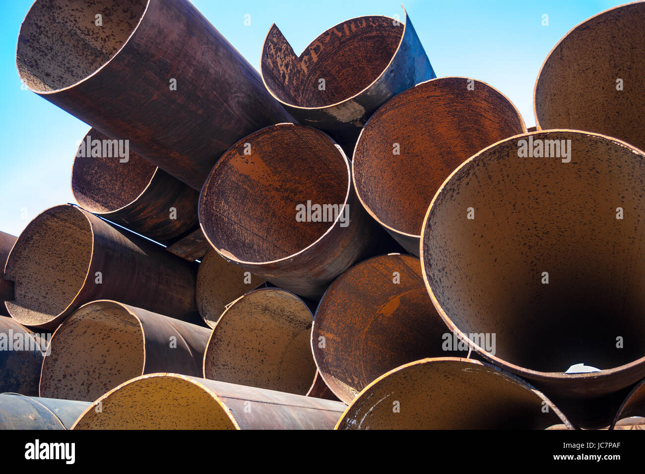 Lots of rusty metal pipes put together Stock Photo - Alamy