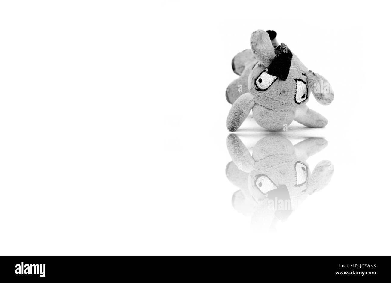 Hand made kids toy and its reflection isolated on white. less is more ...