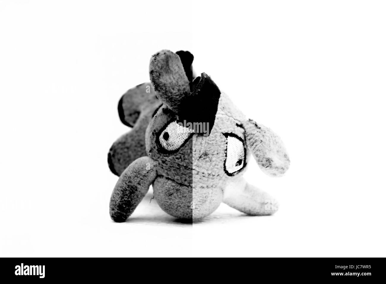 Hand made kids toy and its reflection isolated on white. less is more ...