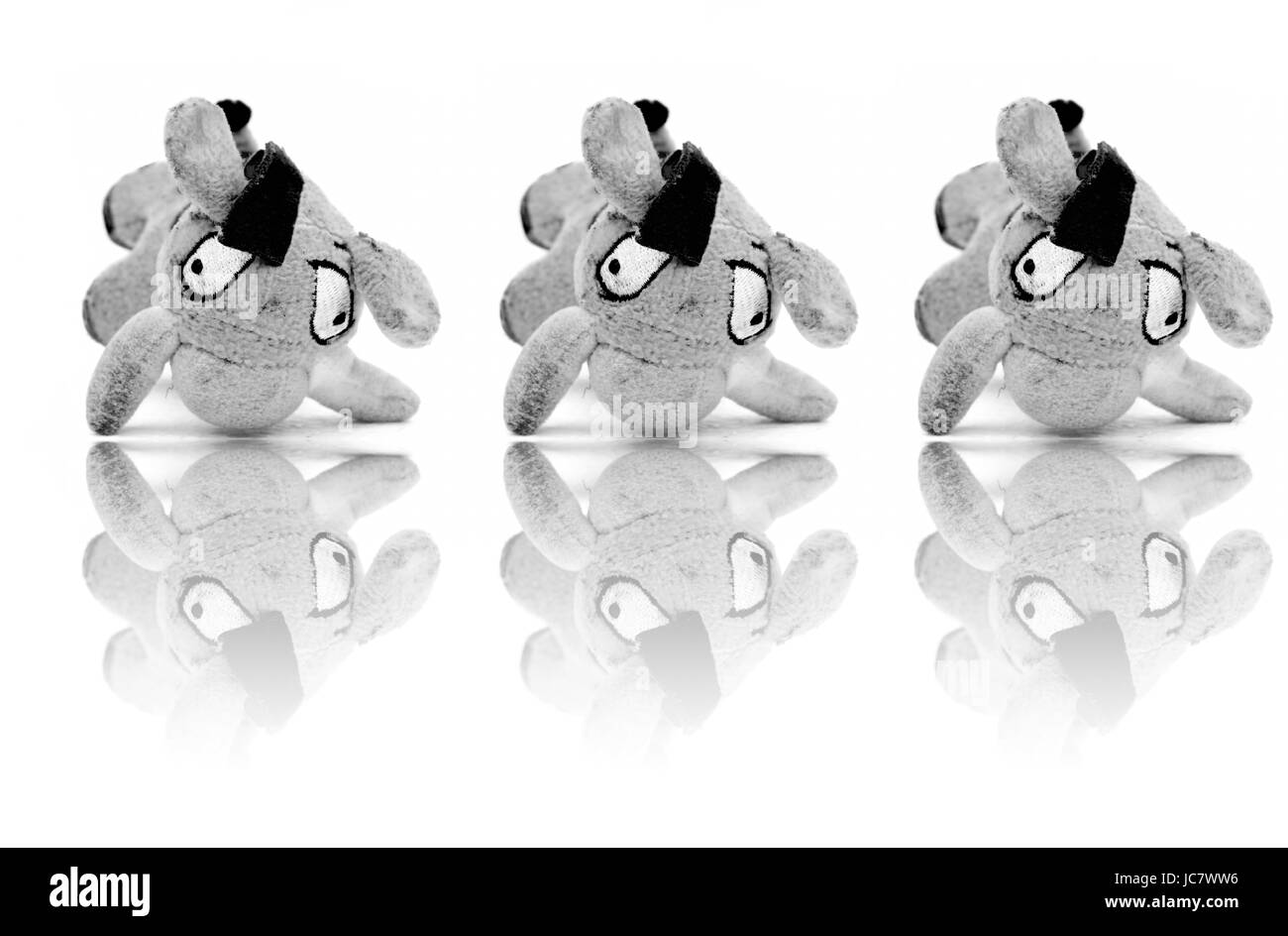 Hand made kids toy and its reflection isolated on white. less is more ...