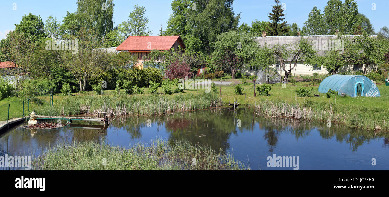 Typical Lithuanian rural landscape - on the bank of a forest pond no ...