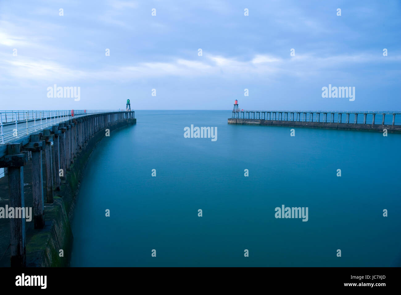 Entrance to the harbour at Whitby, North Yorkshire with its two ...