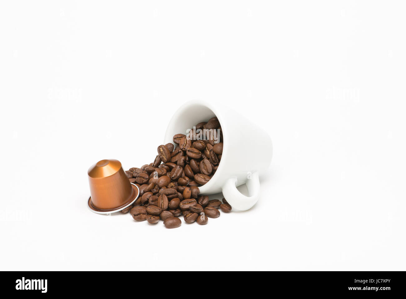 Seed of coffee with capsule on white background Stock Photo - Alamy
