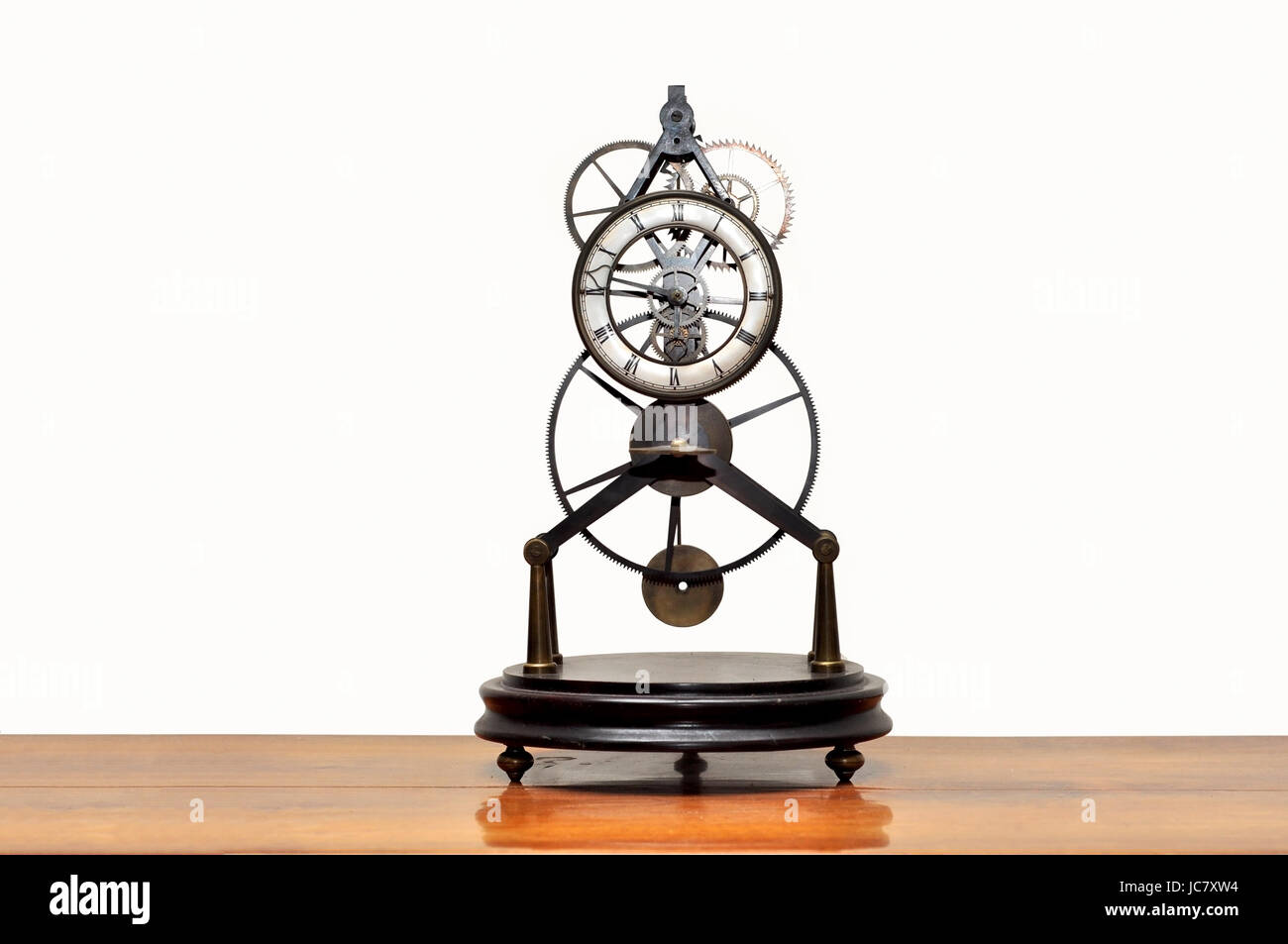 Old clock mechanism with gears over white background Stock Photo - Alamy