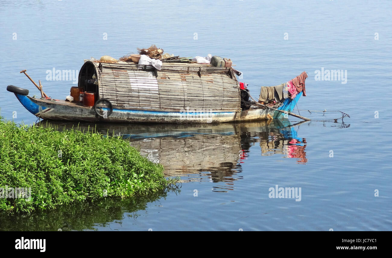 waterside scenery with rural houseboat at the Tonle Sap, a river in ...