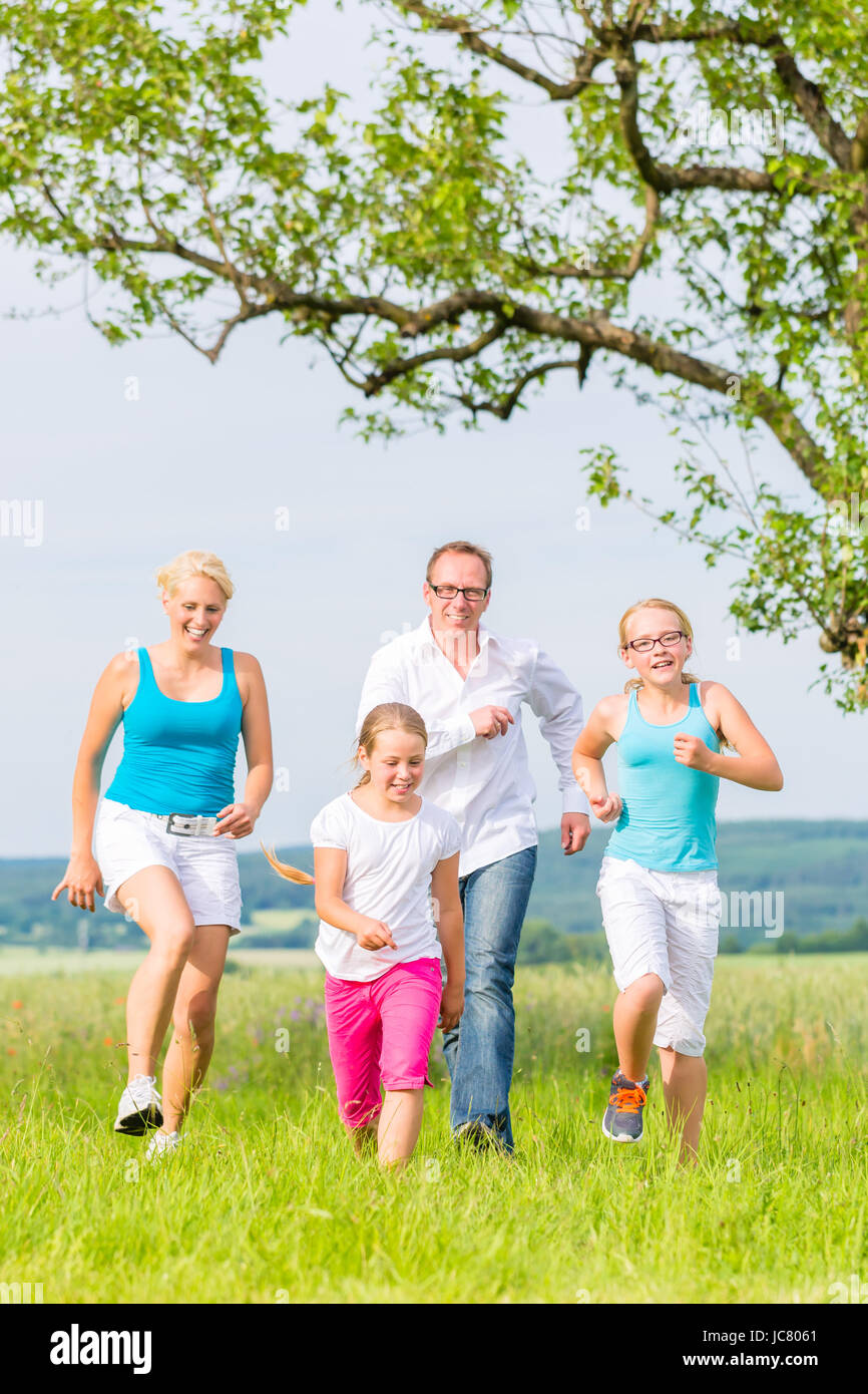 Children running over field hi-res stock photography and images - Alamy