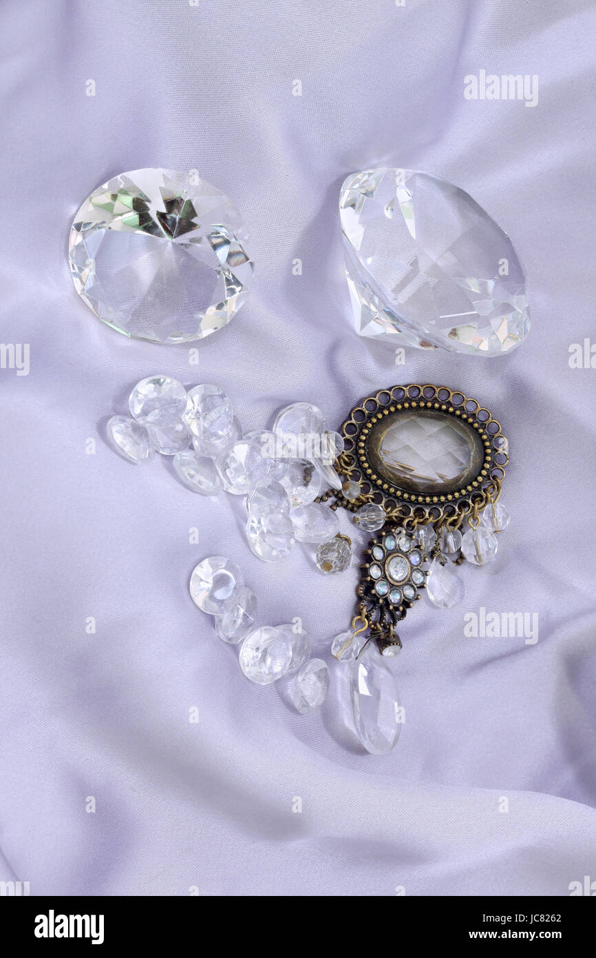 Luxury sparkling clear diamonds on silk sheet Stock Photo - Alamy