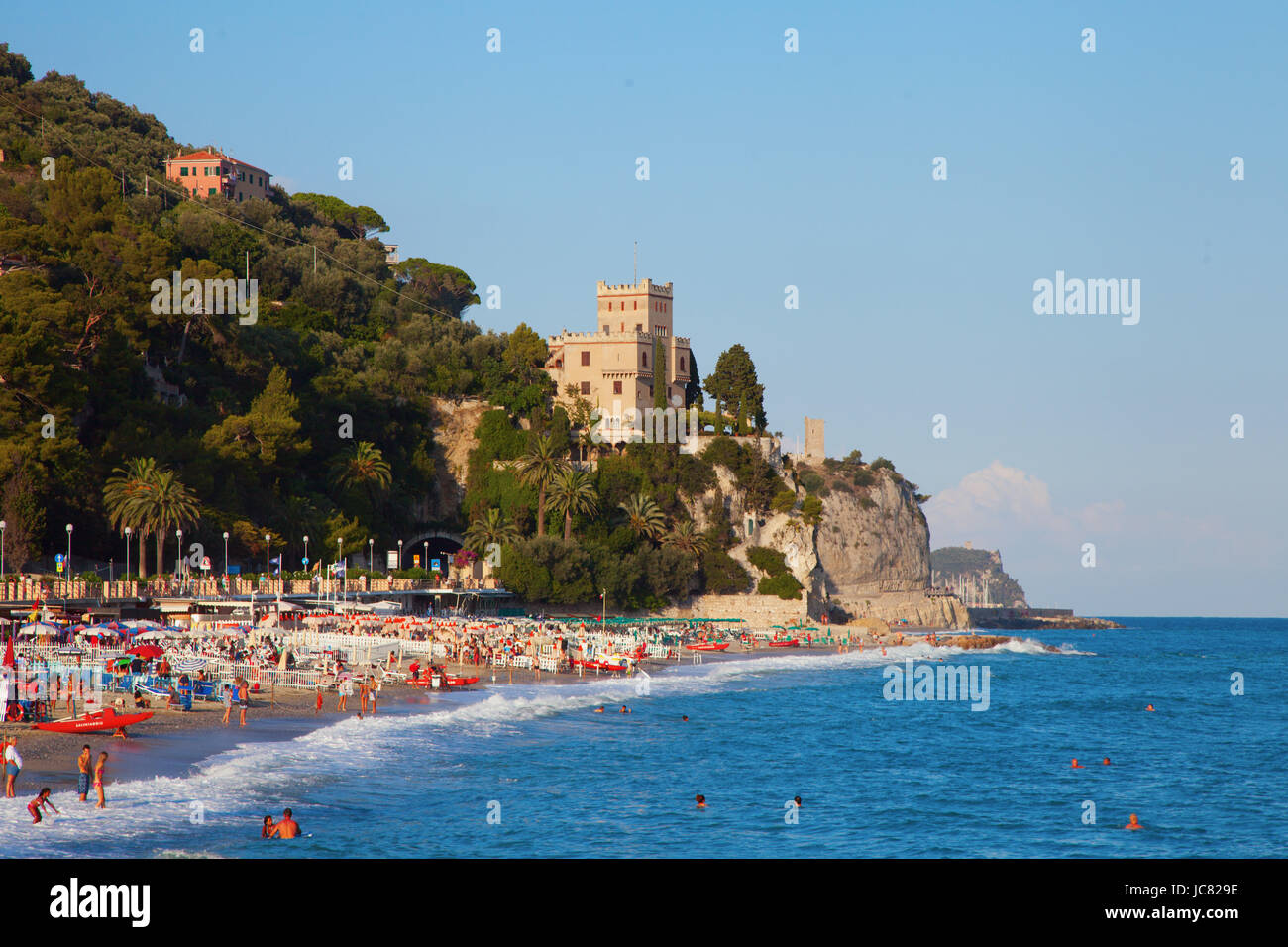 Beach and sea of Finale Ligure, Italy, with castle on the hill Stock ...