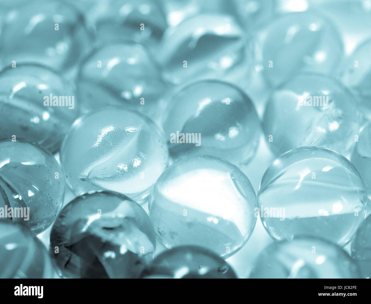Coloured glass marble spheres toy background pattern - cool cyanotype ...