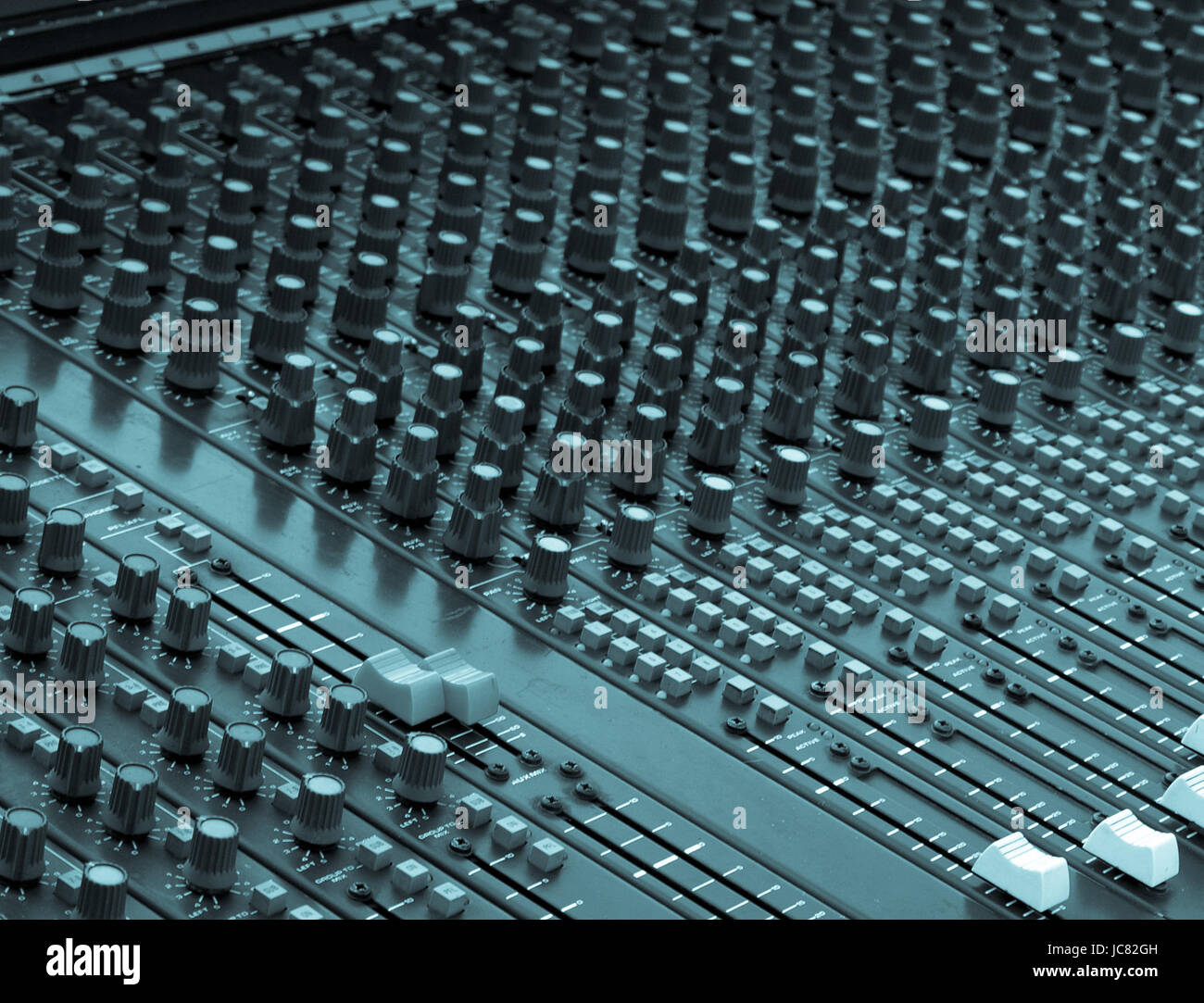 Detail of a soundboard mixer electronic device - cool cyanotype Stock ...