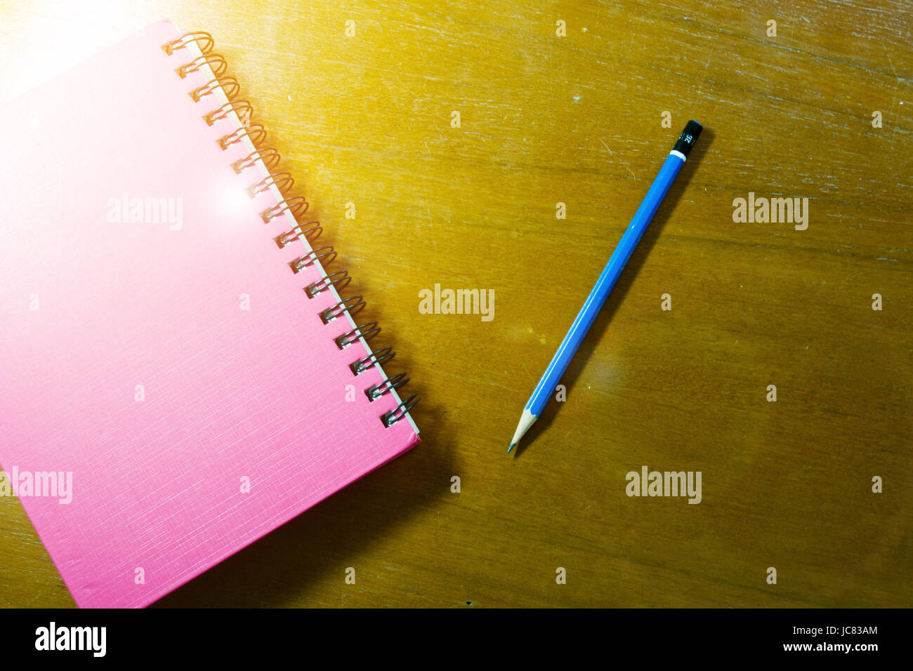 Pencil book on white background Stock Photo - Alamy