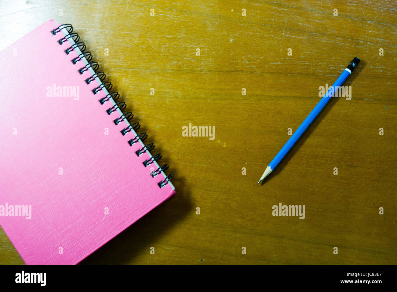 Pencil book on white background Stock Photo - Alamy