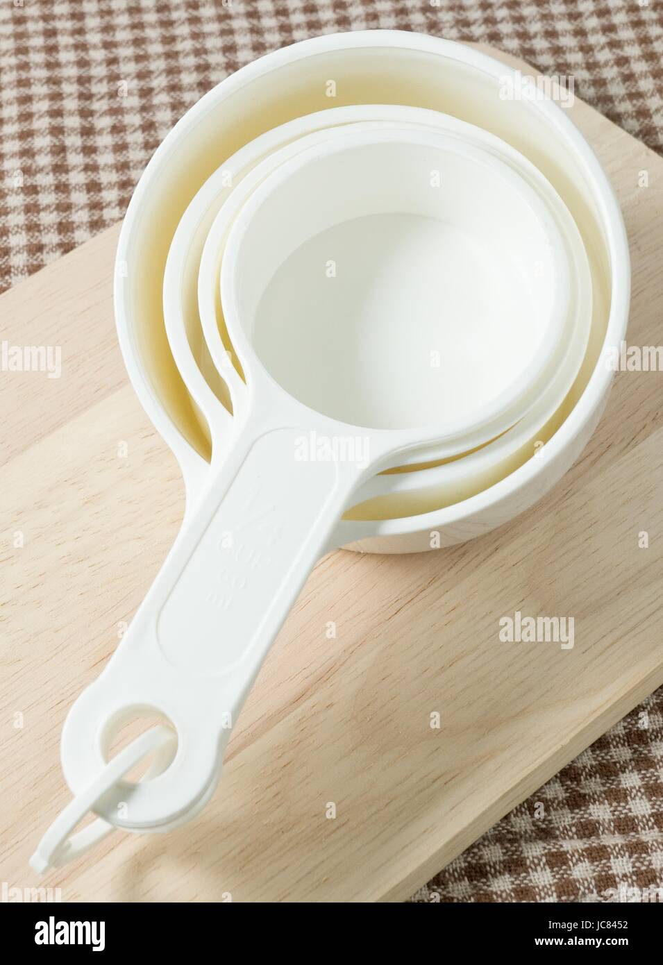 Kitchen Tools and Equipment, Four Plastic Measuring Cups in Different ...